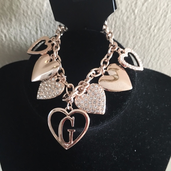 Guess | Jewelry | Guess 7 Hearts Pave Adorned Charm Bracelet | Poshmark